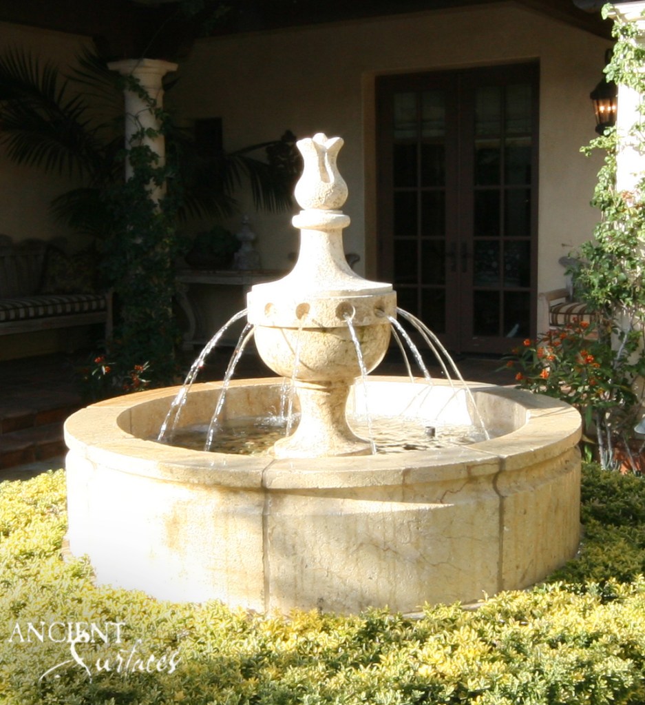 Summertime, and the livin’ is easy, water, sun and a limestone fountain ...